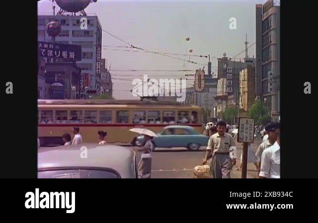 Busy streets in Tokyo include traffic, buildings, pedestrians, cable ...