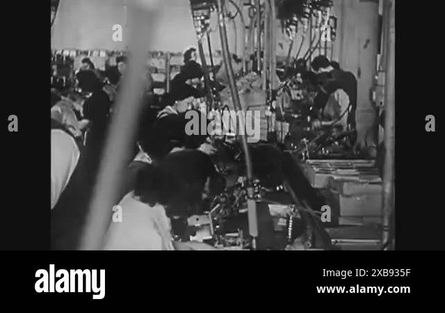 Televisions being assembled in a factory and TV appliance stores and ...