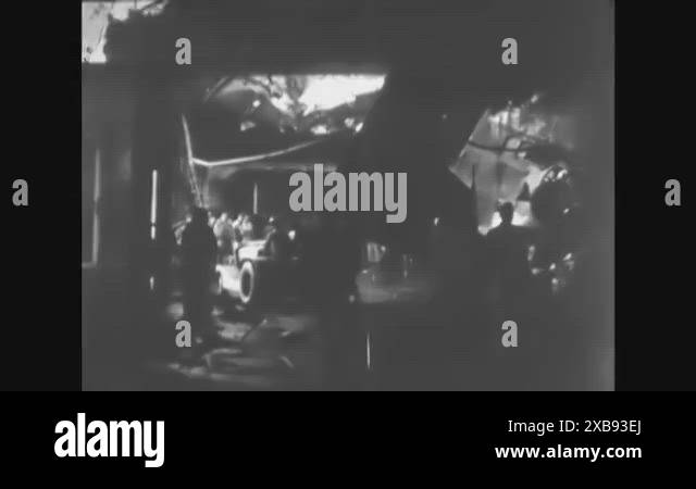 1945 - Men clean up wreckage inside and outside of hangar on the USS ...