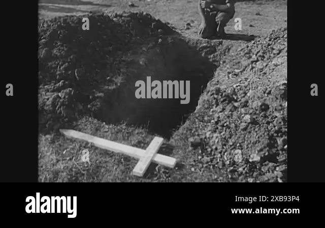 1947 - Grave-diggers in Belgium take corpses out of graves and place ...