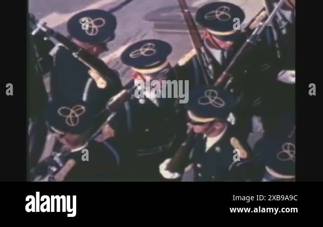 1971 - Rifles are passed in perfect precision while soldiers of the US ...