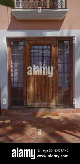 Traditional wooden door with iron details on a colonial house in mexico ...