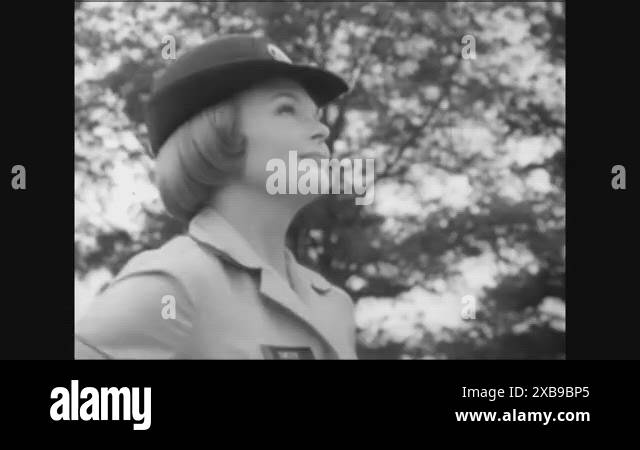 A WAC army band plays the national anthem while the flag is lowered in ...