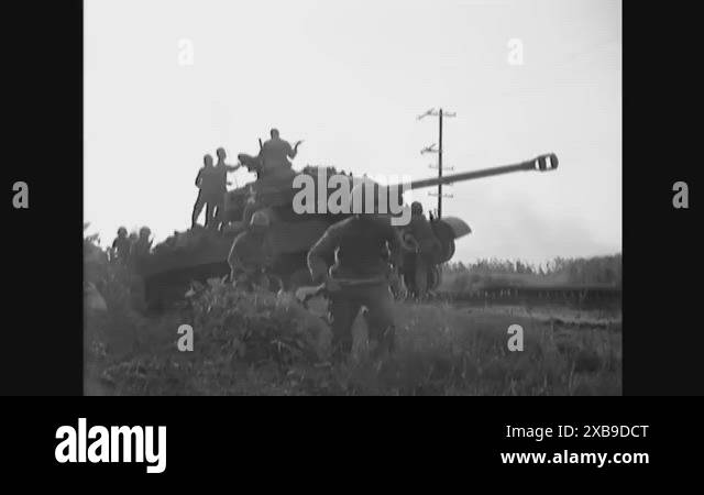 1950 - Marines are coming off a tank in a field in Korea. Views of ...
