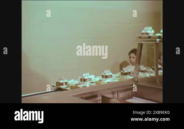 Children with mental disabilities choose their food in a cafeteria and ...