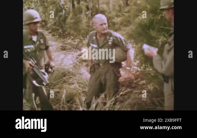 1974 - Army officers speak, soldiers search the jungle and a squadron ...