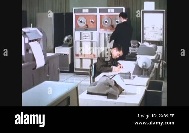 Computer engineers correlate data in a computer laboratory. Helicopters ...