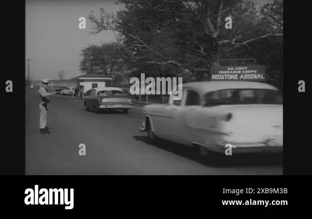 Civilian scientists and engineers work for a military rocket research ...