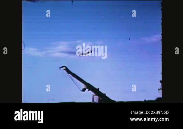 Captain Joseph Kittinger flies through the air tethered to a giant air ...