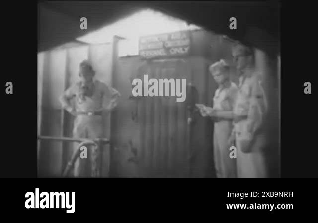 Scientists from the Manhattan Project prepare their instruments onboard ...