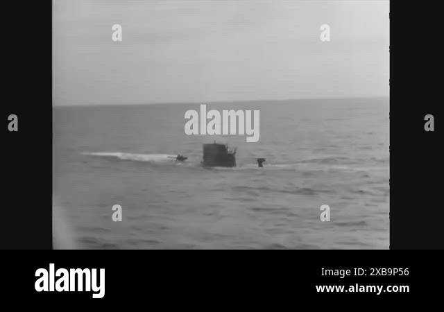 1945 - The conning tower and two guns of a German U-boat appear above ...