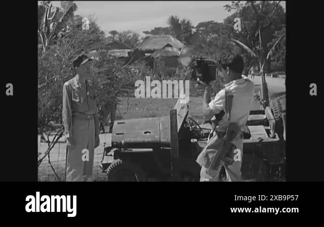 1945 - A US Army photographer takes pictures of General Wing, and a one ...