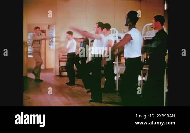 Previously wounded soldiers perform physical exercises as part of their ...