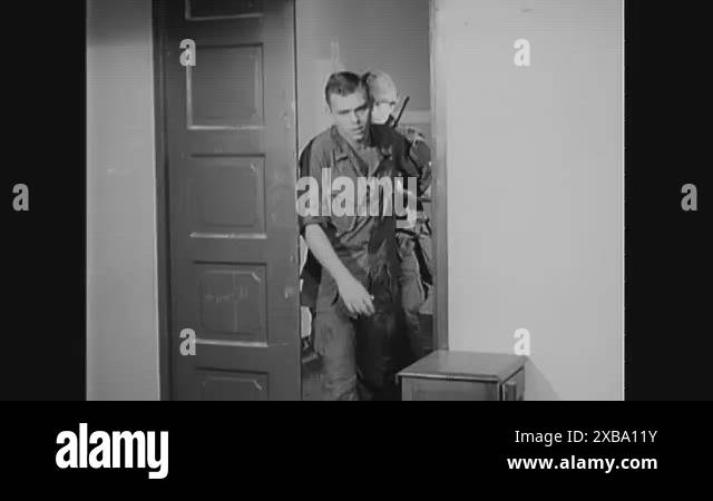 A United States Army interrogator and a military policeman rush in and ...