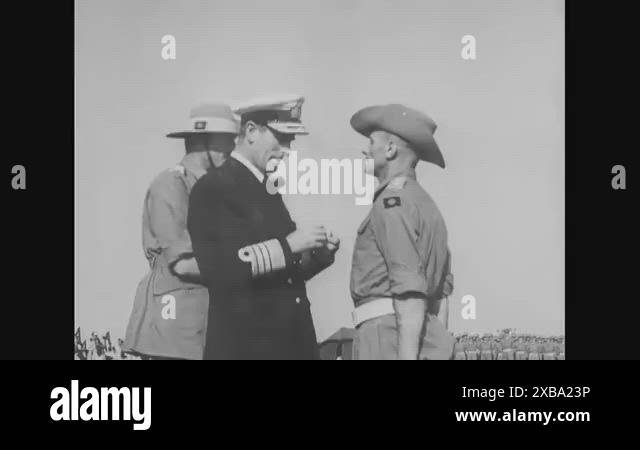 1945 - Mountbatten presents medals to soldiers and a bagpipe band plays ...