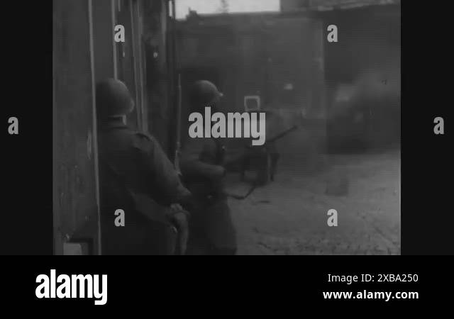 1945 - Soldiers in Worms, Germany fire rifles, take prisoners, and walk ...