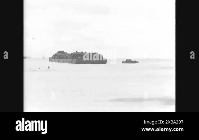 1944 - US soldiers unload rations from Barge on Utah beach to trucks ...