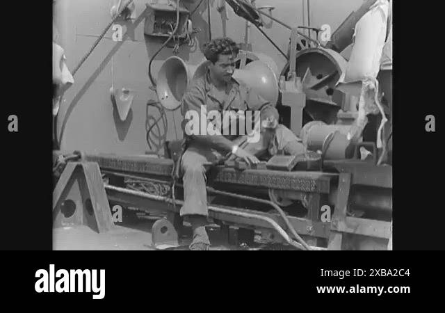 1944 - US soldiers aboard liberty ship heat k-rations in boiler and eat ...