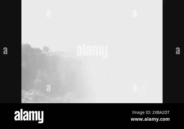 1948 - American flags and palm trees wave in the breeze over the US ...