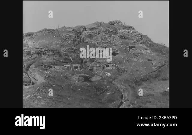 Soldiers arrange the bodies of their dead colleagues in row on a hill ...