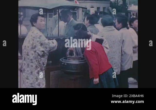 1959 - Tourists admire shrines, street vendors exhibit their ...