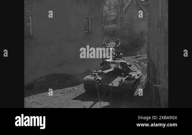 Army tanks travel towards a combat area in a simulated war operation in ...