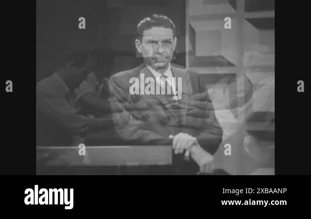 A map of a fallout shelter is explained by a presenter, in a studio, in ...