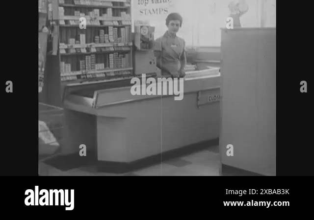 A cashier checks an unmanned cart out at a check stand, a dog dances ...