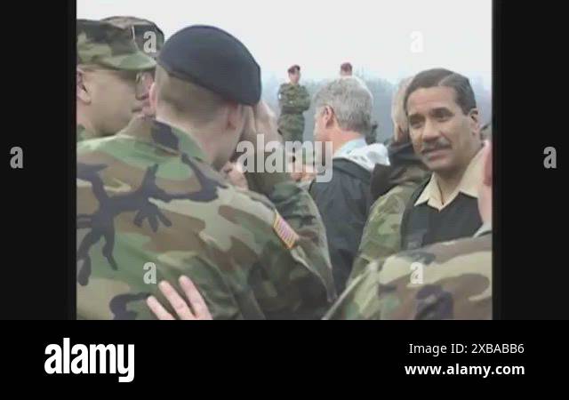 President Bill Clinton and his wife and daughter greet soldiers at a ...