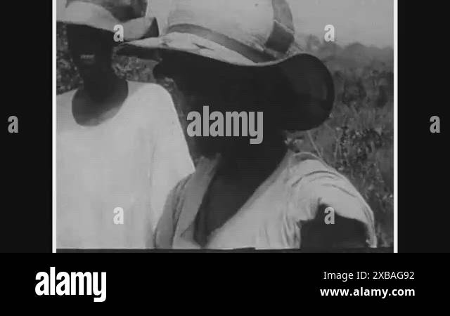 Laborers work on a compound in Nigeria, a white man undergoes various ...