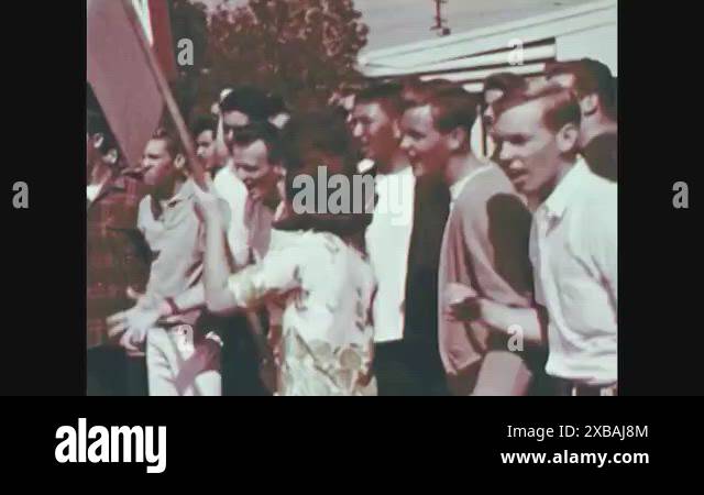 Police officers approach a crowd of rioting protesters in formation ...