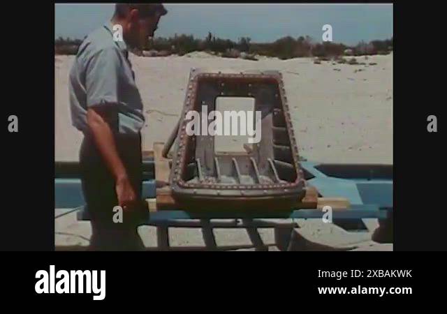 An emergency escape hatch is built and tested for a spacecraft in 1961 ...