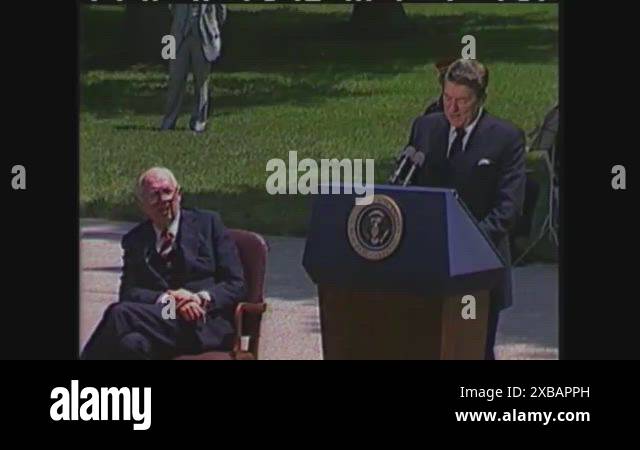 President Ronald Reagan speaks about working together with members of ...