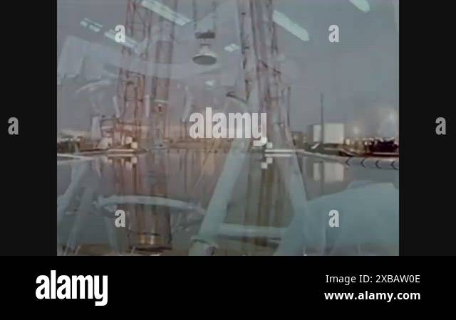 Splashdown tests for the Apollo spacecraft at an outdoor pool and a ...