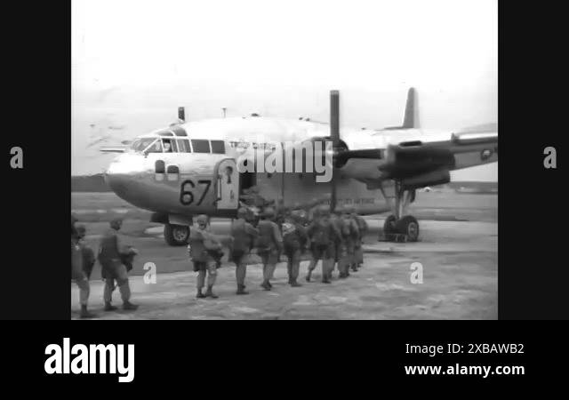 U.S. paratroopers board a C1 19 fighter plane fully equipped, jump and ...