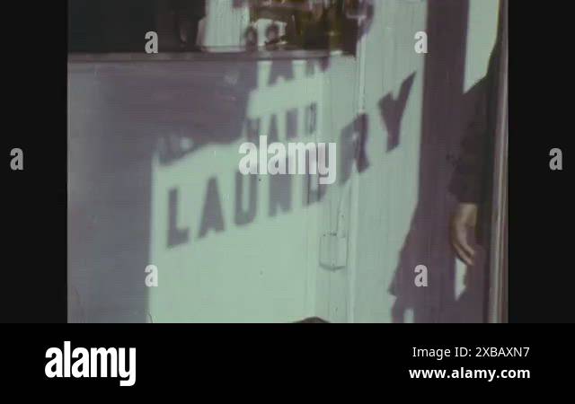 A Chinese hand laundry shop, restaurant and curio shop are shown, in ...