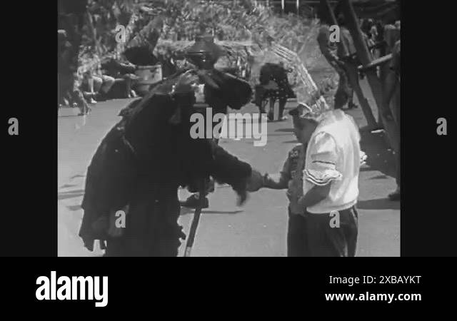 Emmett Leo Kelly, performing as a clown called Weary Willie, and a sea ...