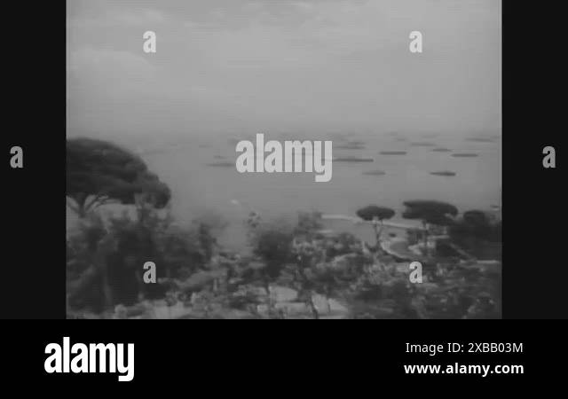 Troops board warships with Secretary of the Navy James Forrestal and ...