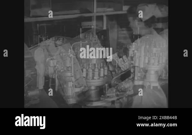 Milk is packaged in cartons on an assembly line and flake ice is ...