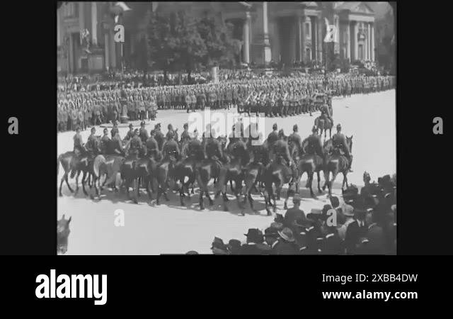 1910 - Large crowd cheers for troops marching in a parade in Germany ...