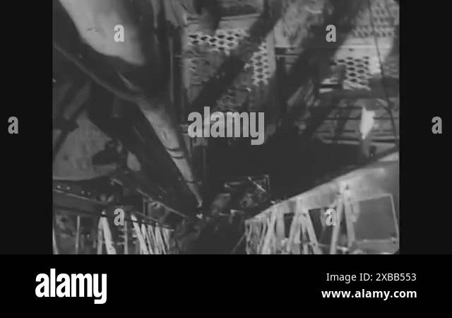 A derrick man stacks his last bit of drill pipe on an oil rig; the ...