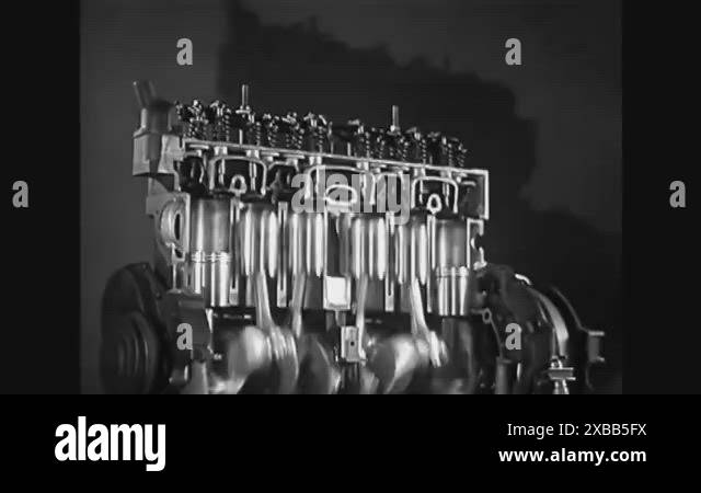 A view inside a working engine is shown, men in a foundry put a flange ...