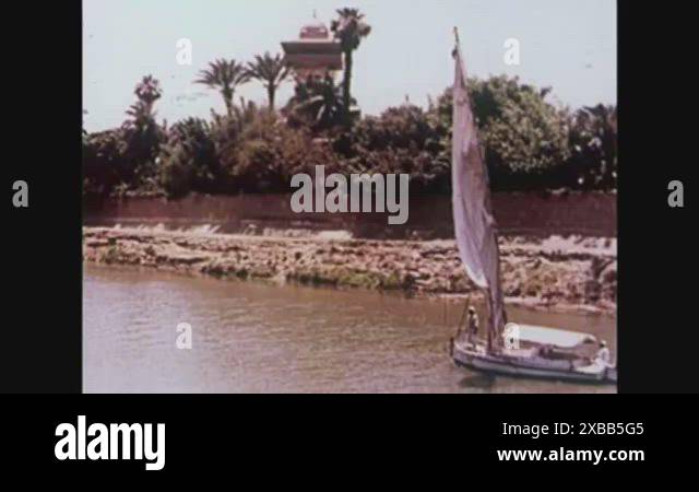 A boat sails along the Nile River and views of the Pyramids and ancient ...