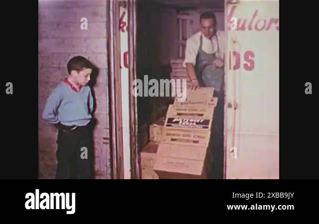 The owner of a Supermarket in the 1950s shows his son around the daily ...