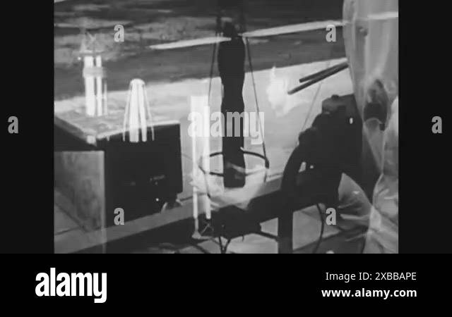 The Explorer 1 satellite is hoisted onto the Jupiter-C rocket, at Cape ...