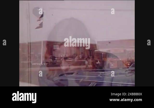 Students walk around a school campus, school buses leave the campus ...