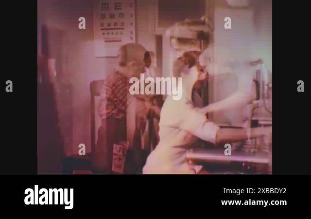 Workers in a lab inspect petri dishes that show germ colonies present ...