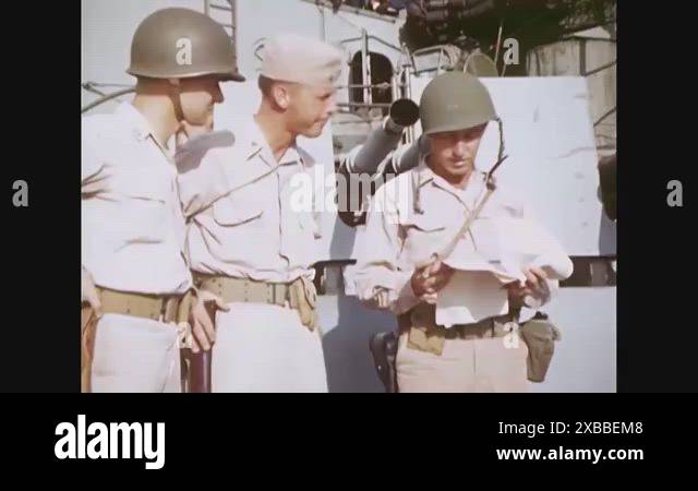 1945 - Naval personnel on the USS Indiana are transported to the USS ...