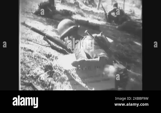 American soldiers blow the swastika off the Reichstag building during ...