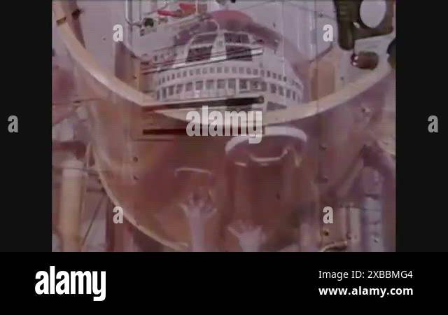 1962 Douglas engineers can, hoist, and connect a Telstar satellite into ...